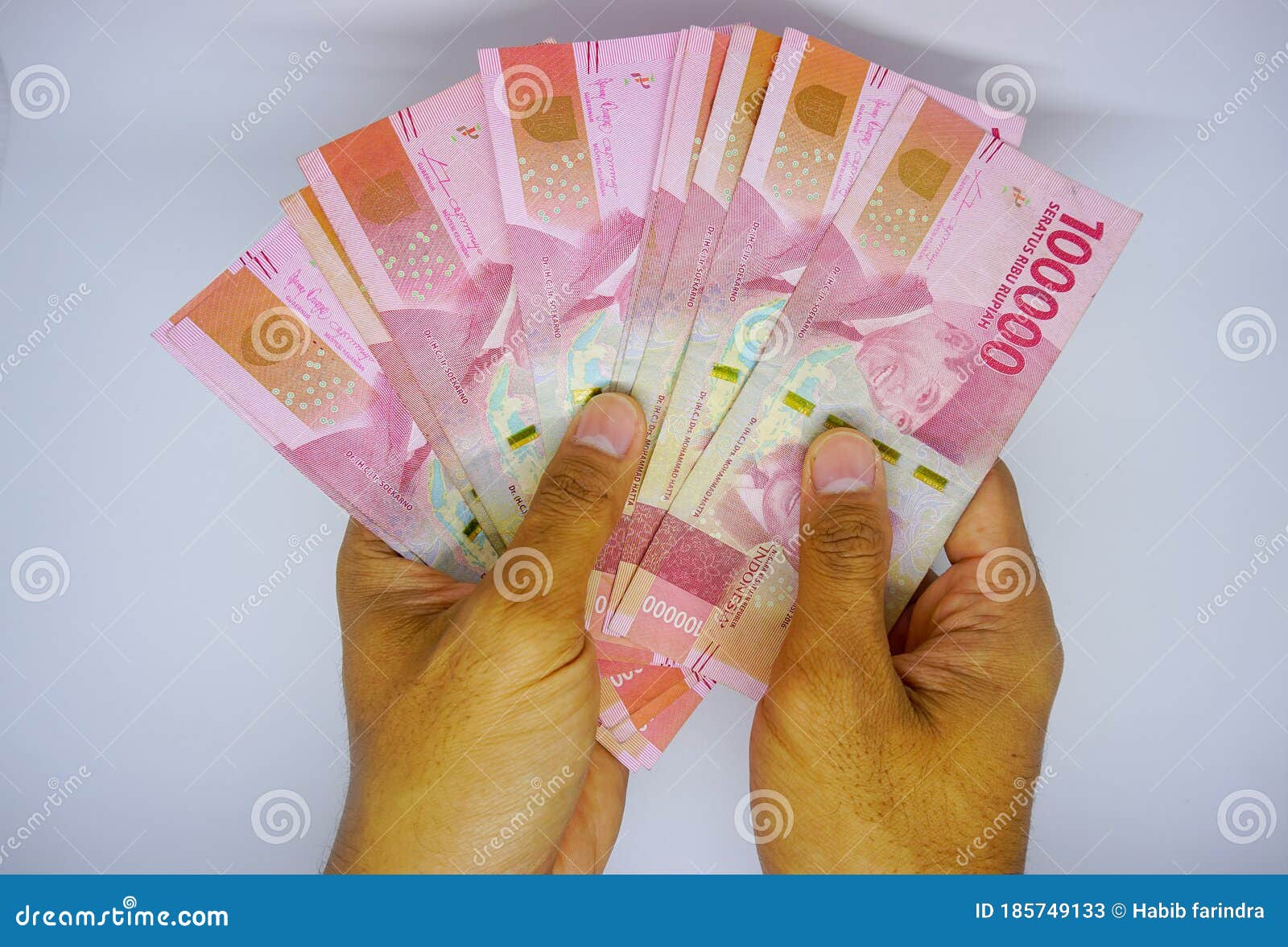 Hand Holding Indonesian Money / IDR Stock Image - Image of counting ...