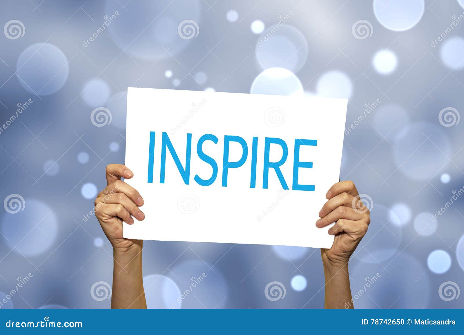 Hand Holding INSPIRE Card with Abstract Light Background. Stock Photo ...