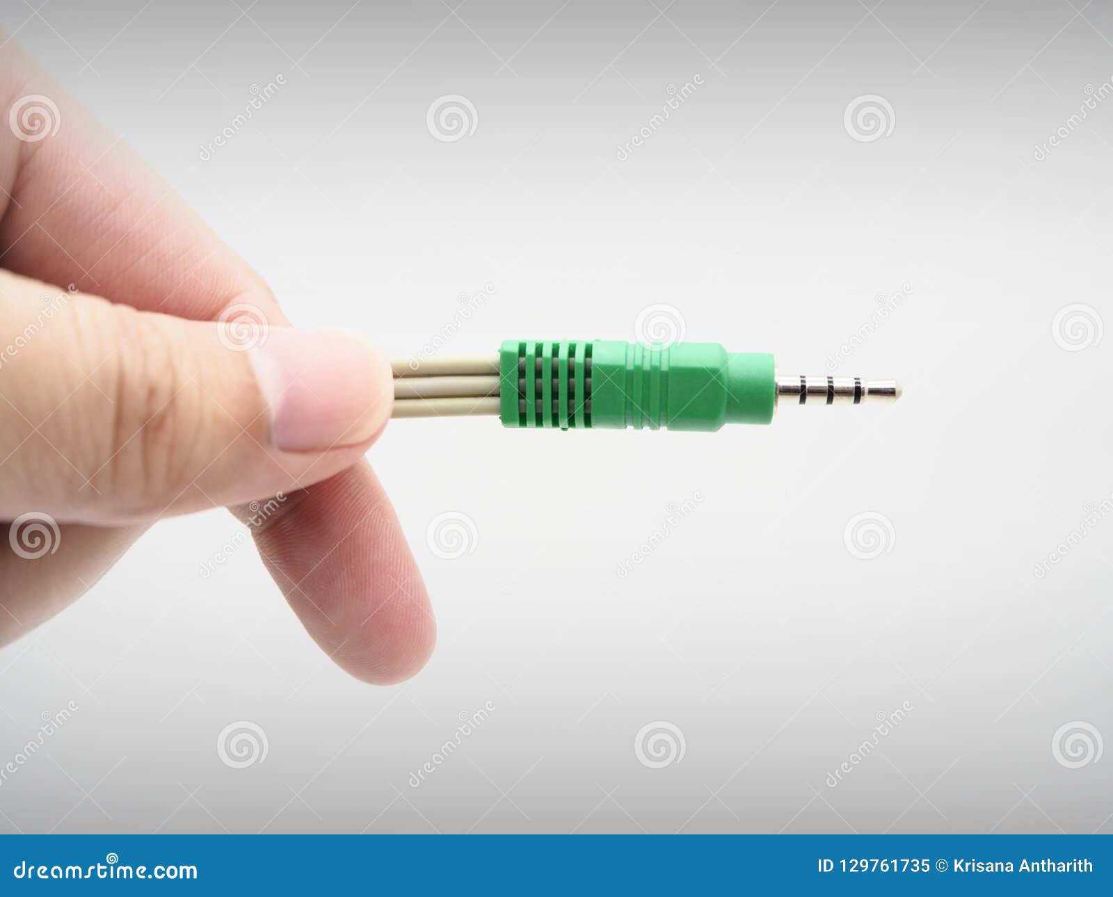 Hand Holding a Jack Instrument Cable on a White Background Stock Image ...