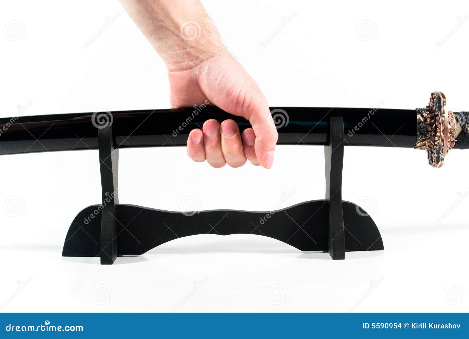 Hand Holding A Japanese Sword In The Sheath Stock Images - Image: 5590954
