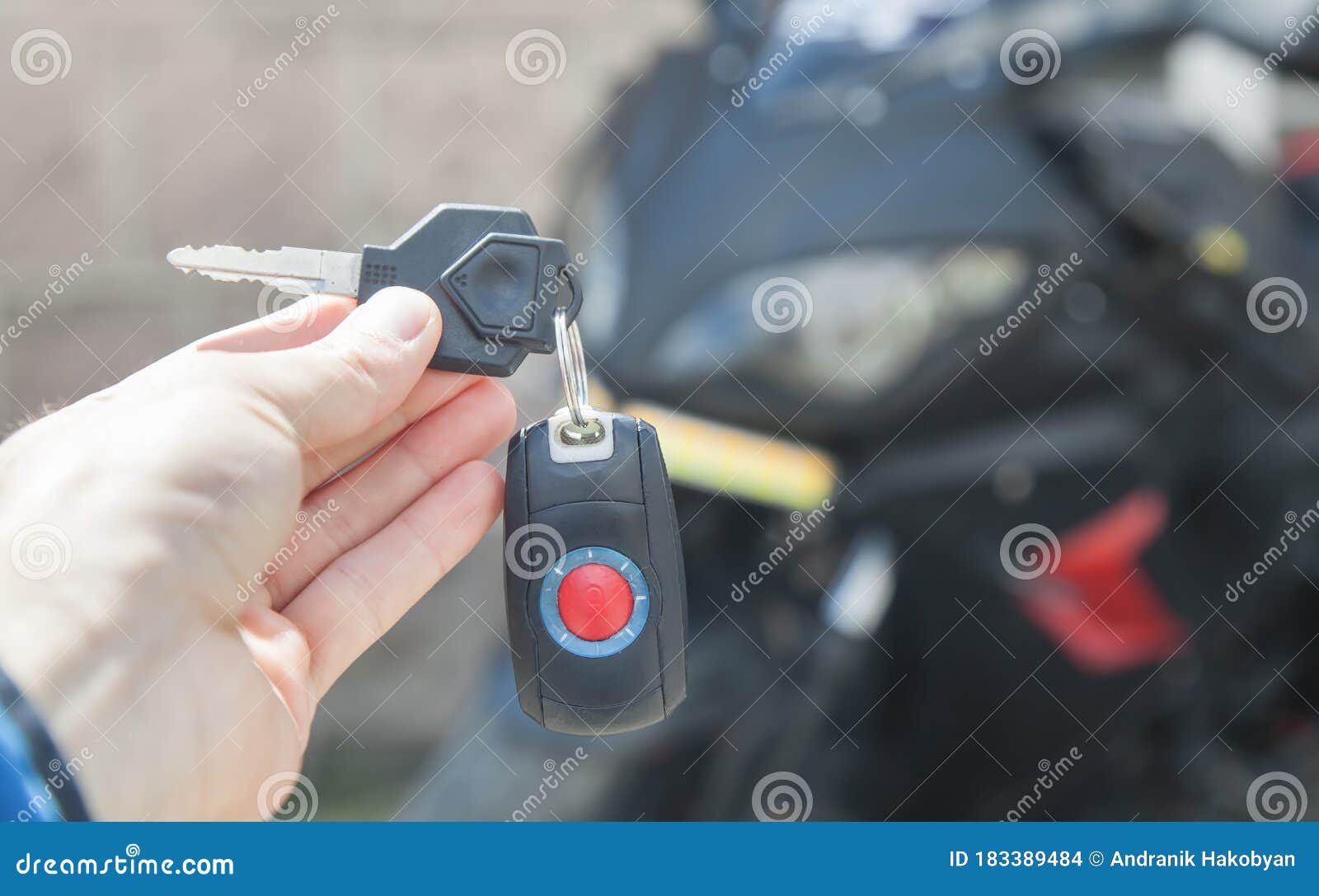Hand Holding Keys on the Background of Motorcycle Stock Photo - Image ...