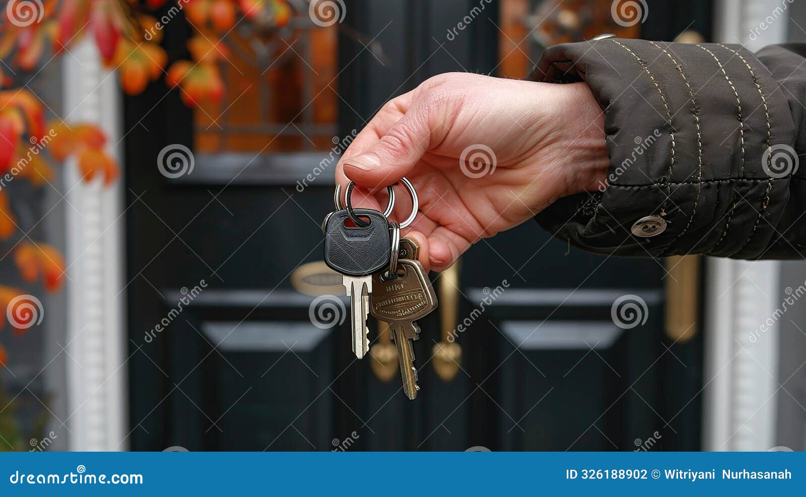 Hand Holding Keys in Front of a Door Stock Photo - Image of doorbell ...