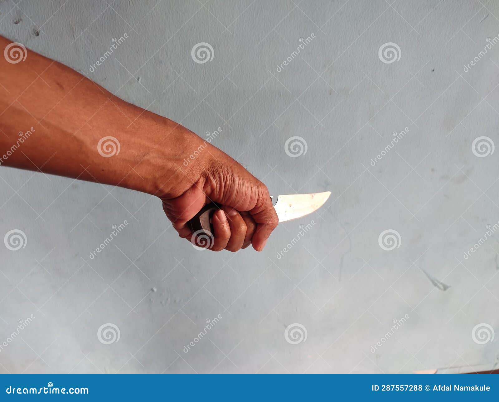 Hand holding knife stock photo. Image of wood, finger - 287557288