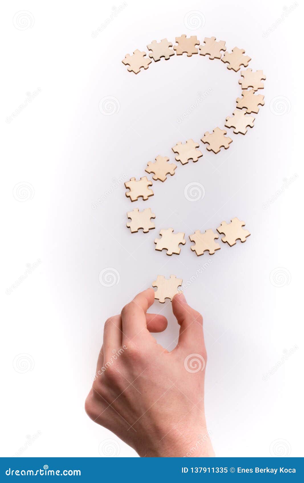 Hand Holding the Last Piece of Question Mark. Question Mark Made from ...