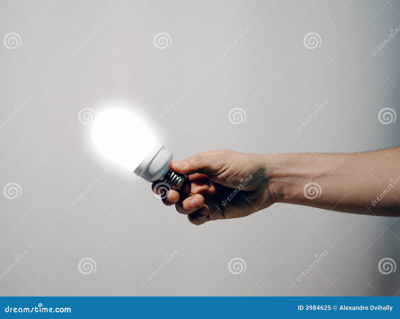 Hand holding light bulb stock image. Image of electricity - 3984625