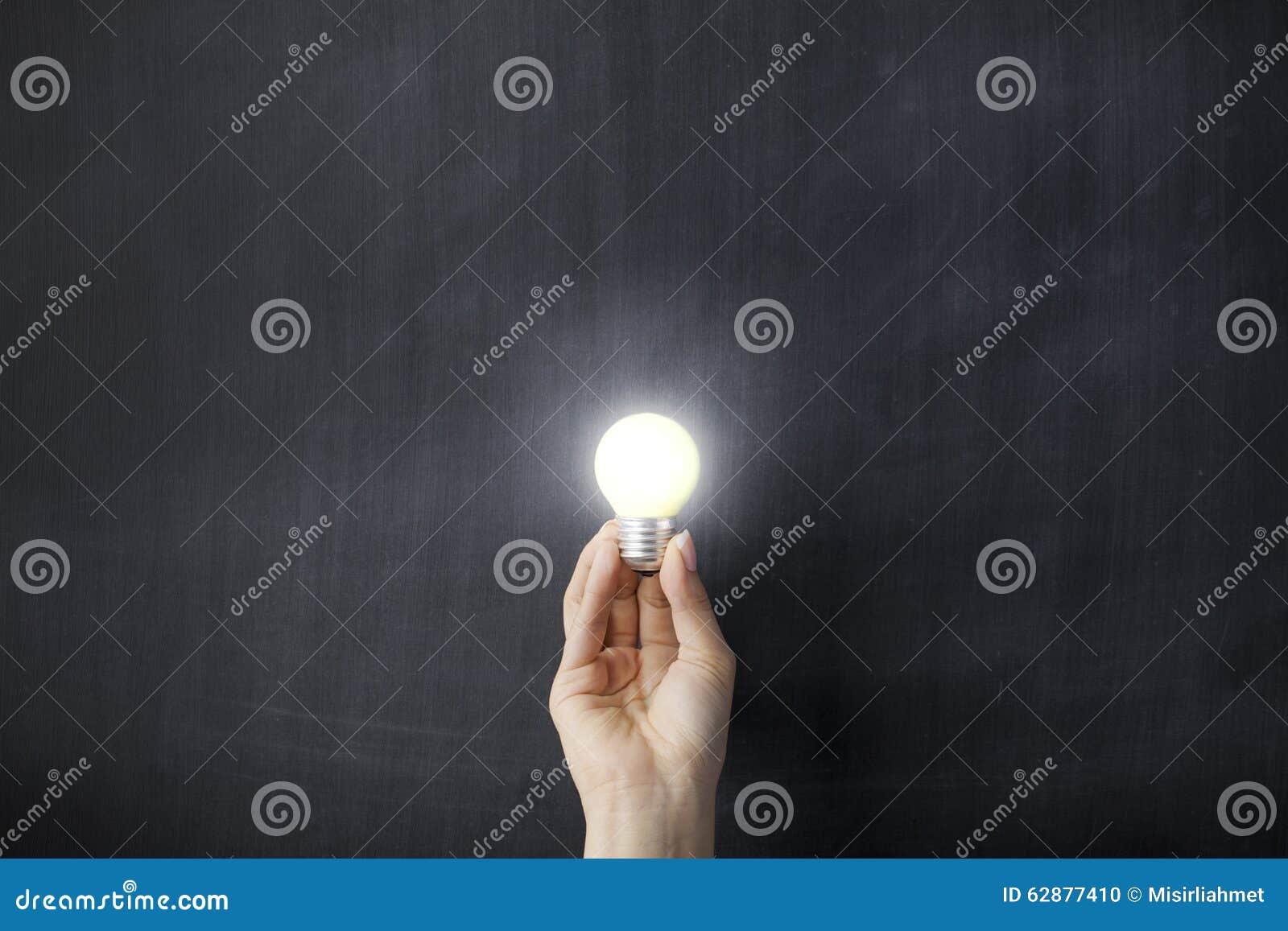 Hand holding light bulb stock photo. Image of holding - 62877410