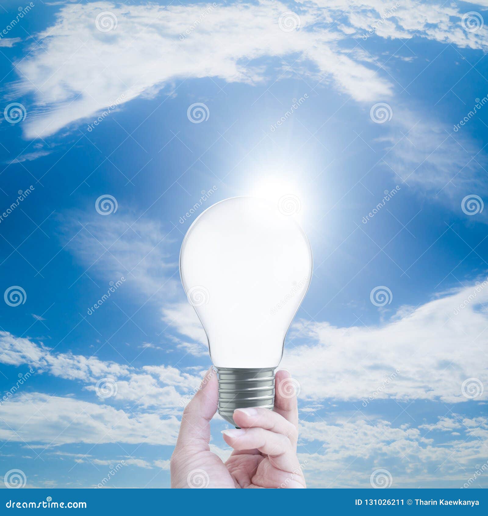 Hand Holding a Light Bulb on Blue Sky Background Stock Illustration ...