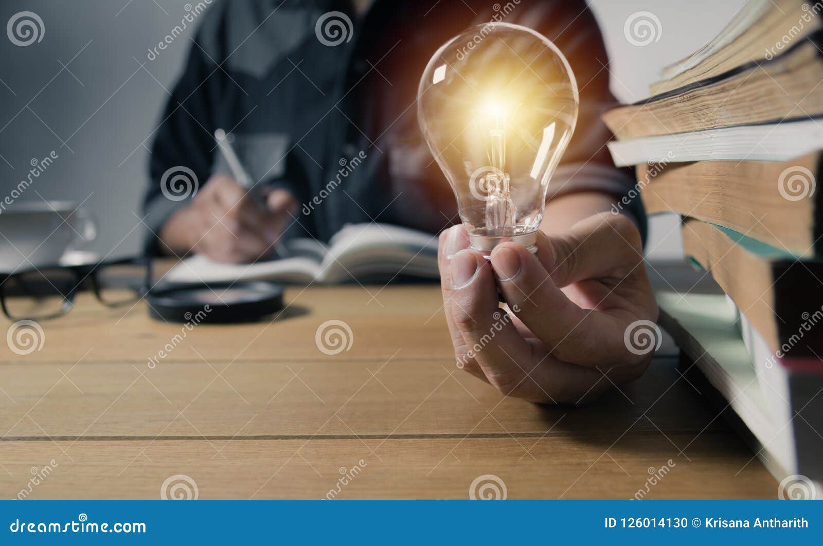 Hand Holding a Light Bulb. Innovation and Creative Concept Stock Photo ...