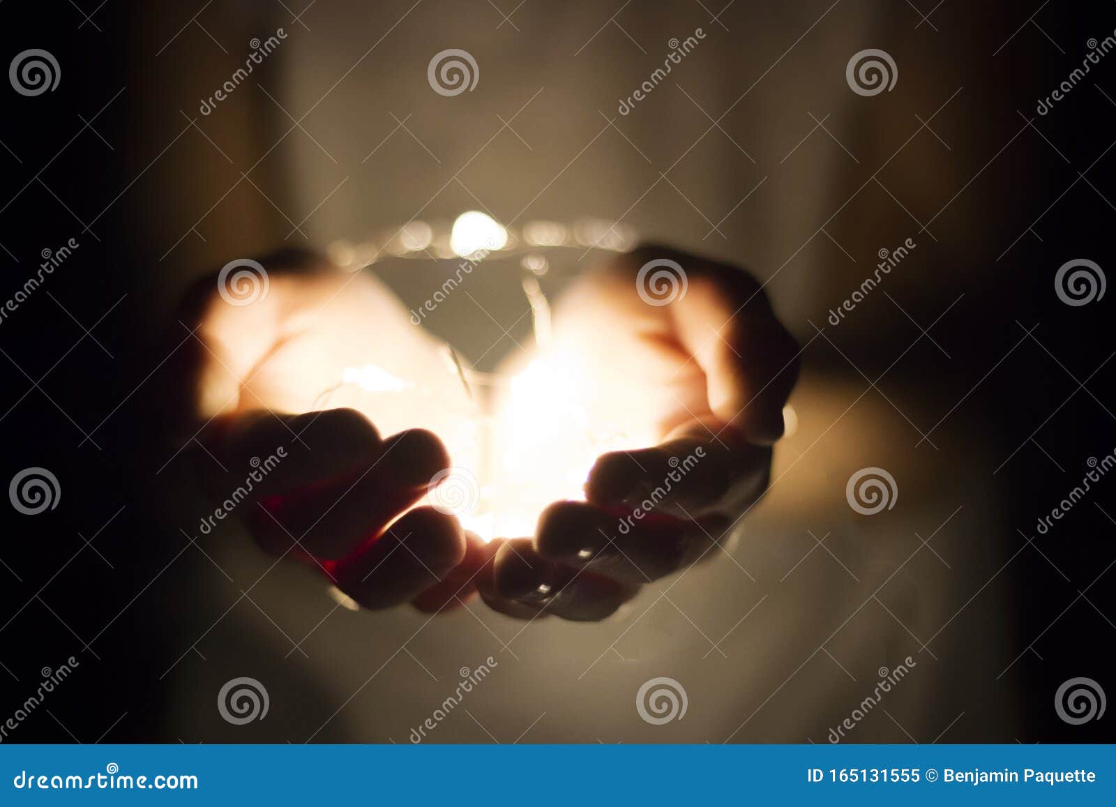 Hand holding light bulb stock image. Image of bulb, black - 165131555