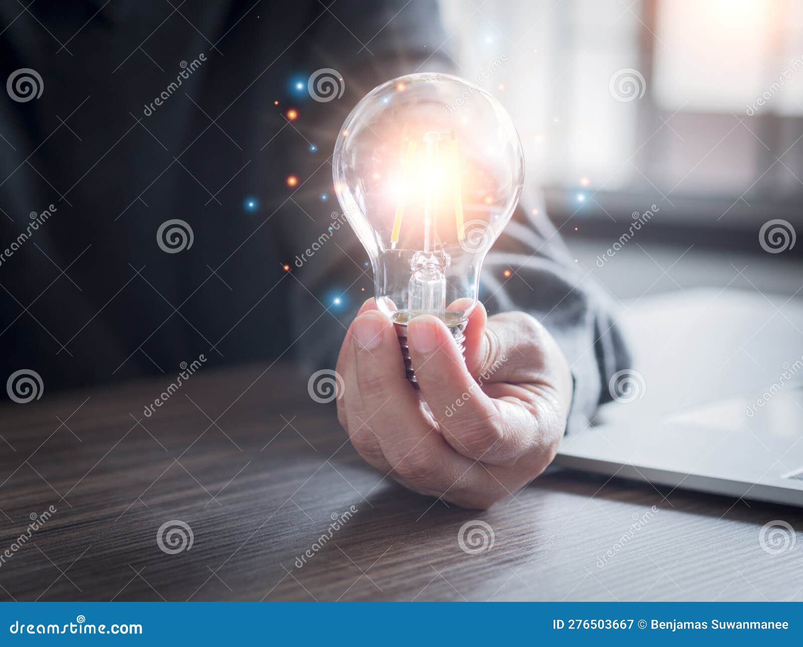 Hand-holding the Light Bulb Represents Creativity, Invention ...