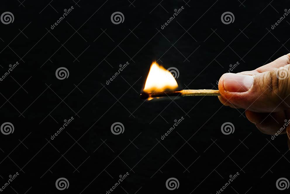 Hand Holding Lighted Match with Black Background Stock Photo - Image of ...