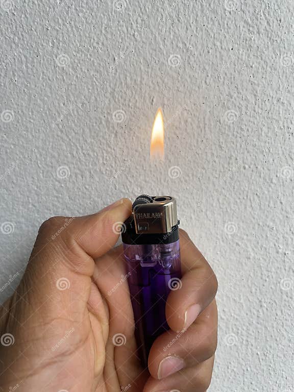 Hand holding lighter stock image. Image of black, purple - 281373739