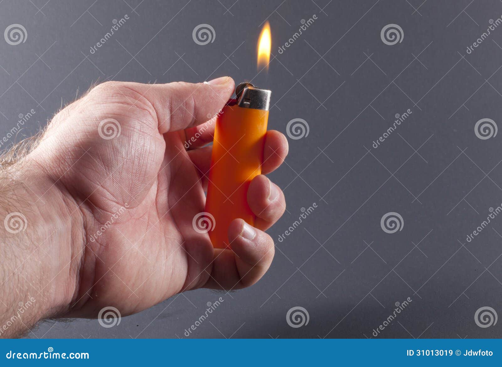 Hand holding a Lighter stock image. Image of light, flammable - 31013019