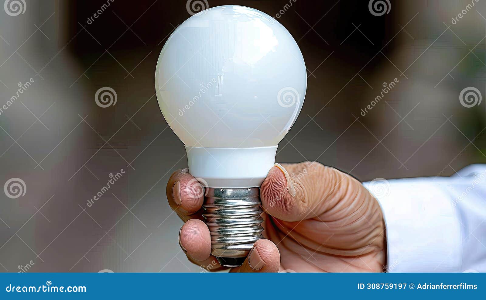 Hand Holding a Lit LED Bulb. Stock Image - Image of luminescence ...
