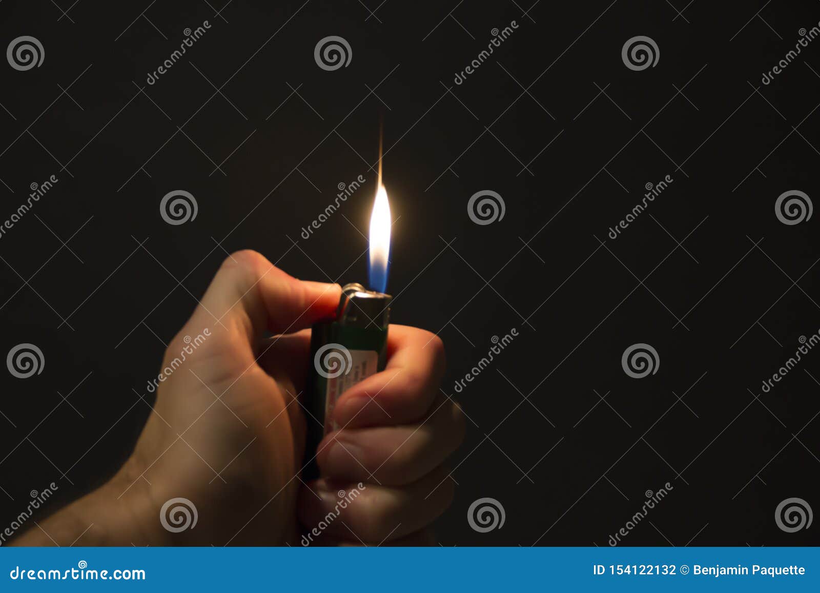 Hand Holding a Lit Lighter in the Dark Stock Photo - Image of hands ...