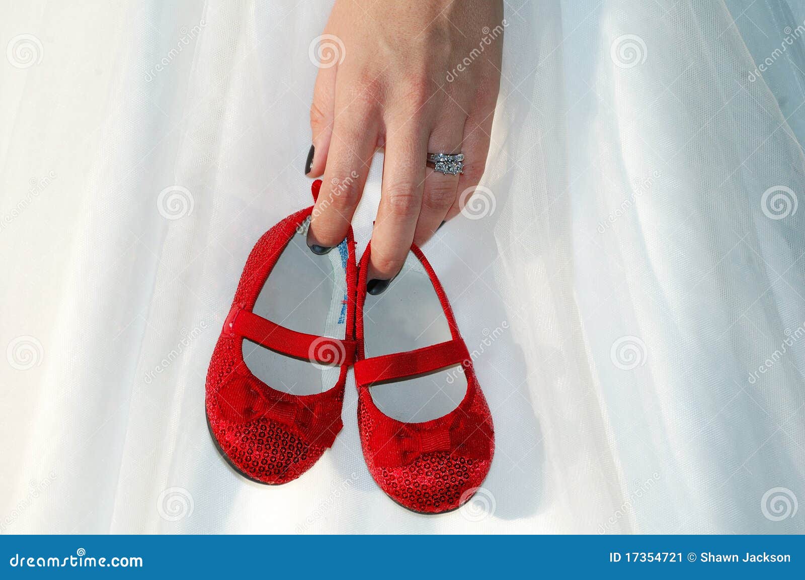 Hand Holding Little Red Shoes Stock Image - Image of hold, white: 17354721