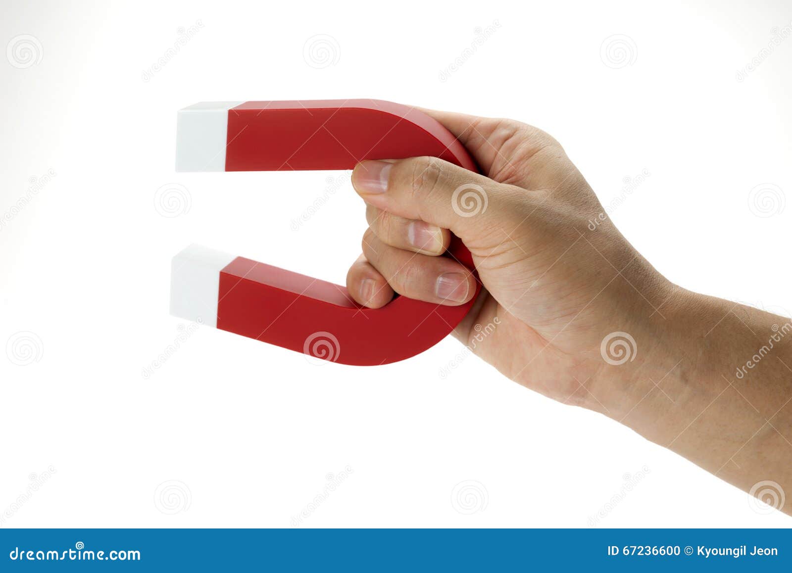 A Hand Holding a Magnet Isolated on White To Pick Up an Object Stock ...