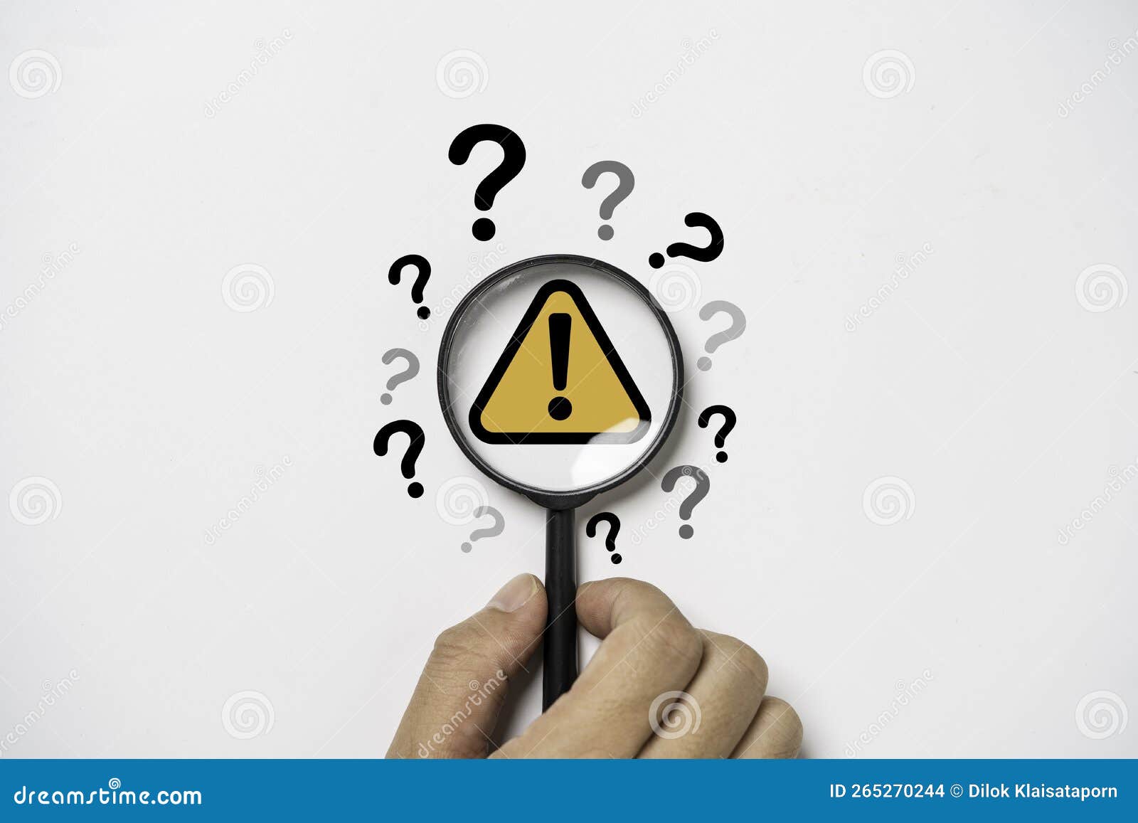 Hand Holding Magnifier Glass with Yellow Triangle Caution Warning Sign ...