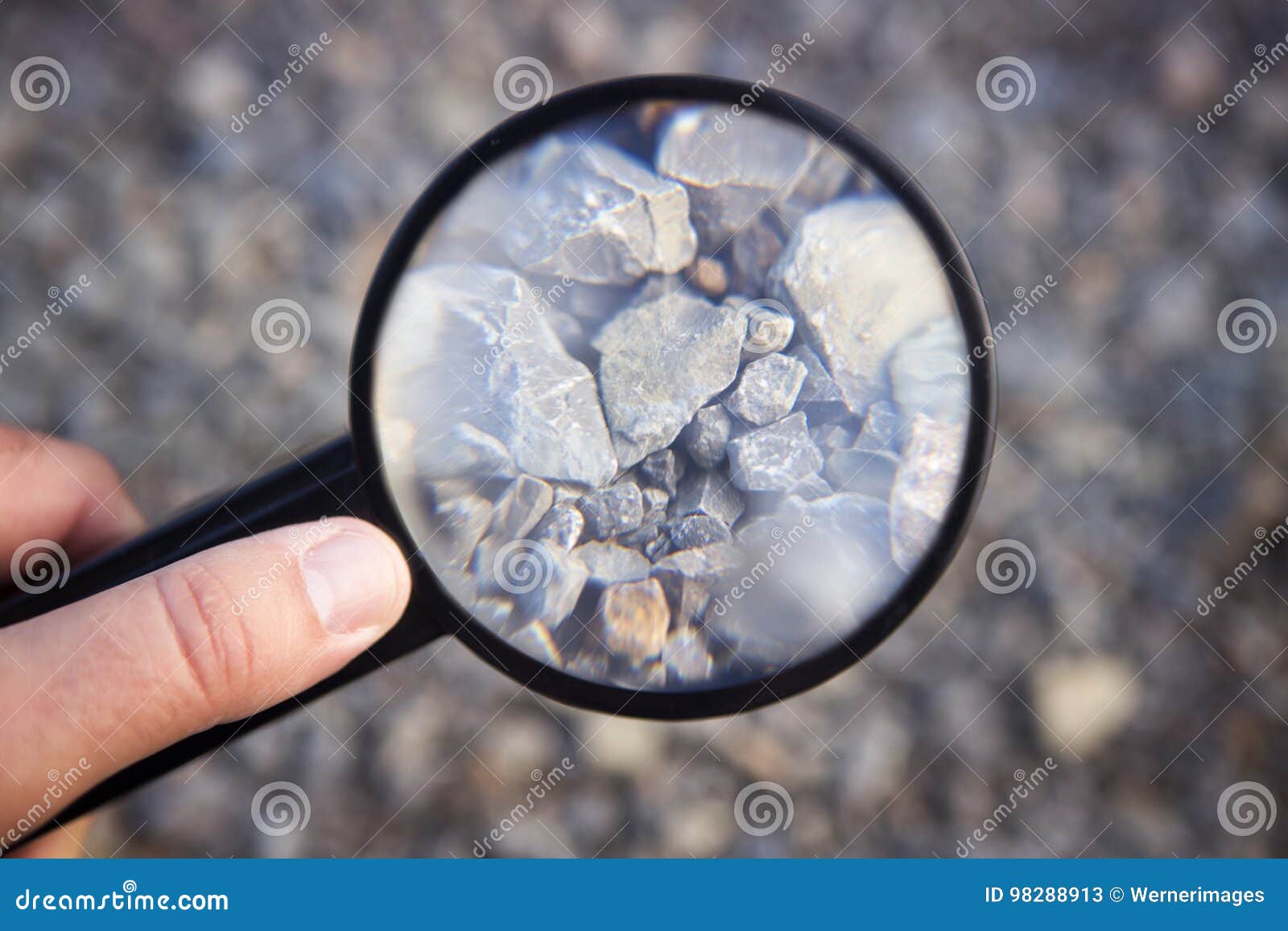 Hand Holding Magnifying Glass at Stones Stock Image - Image of ...