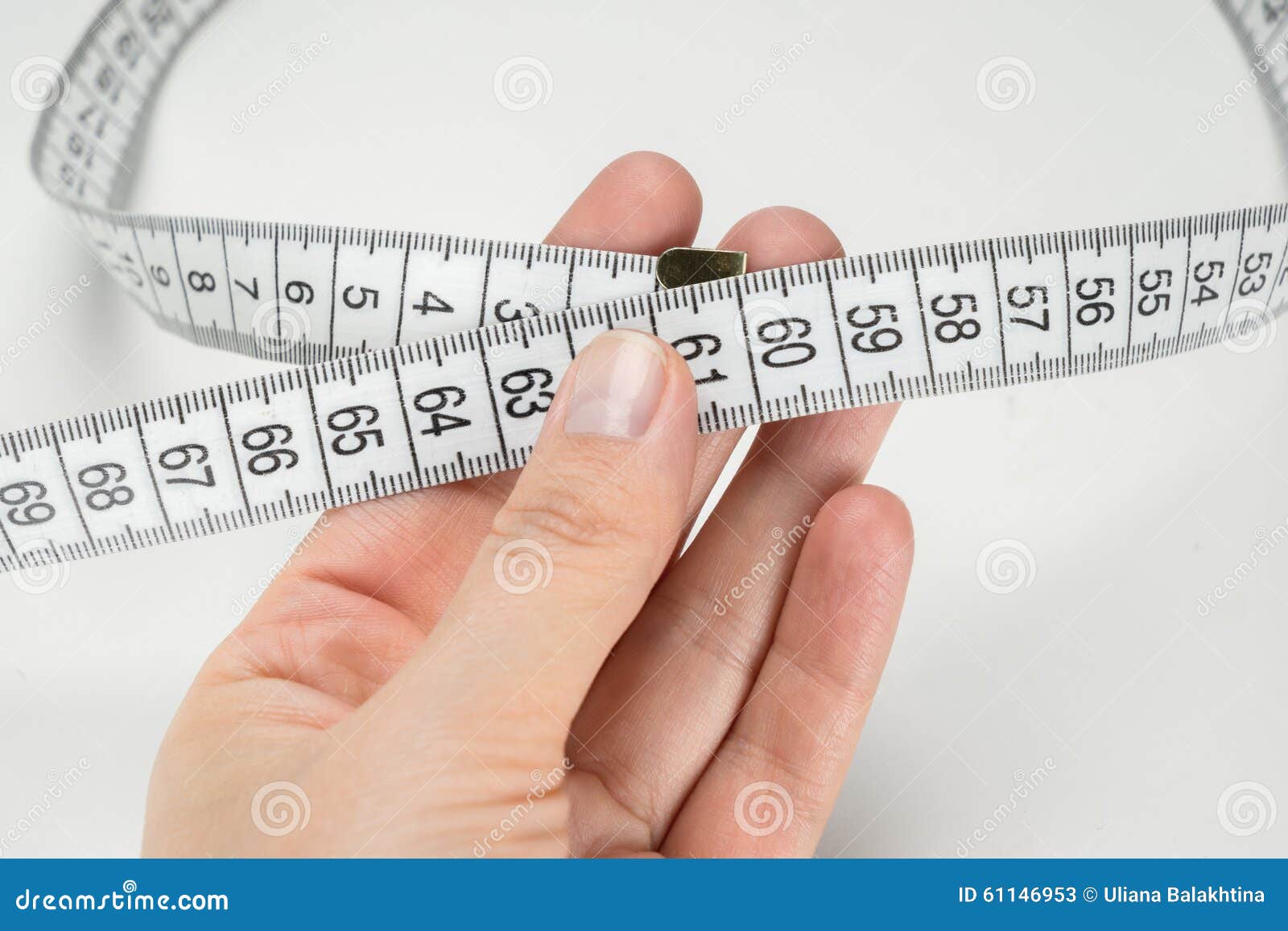 Hand Holding Measuring Tape on a White Background Stock Image - Image ...