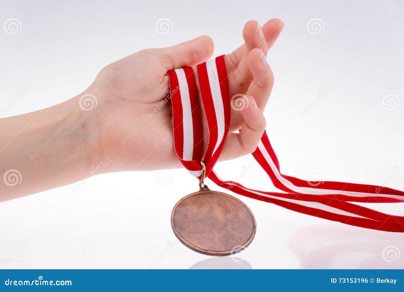 Hand holding medal stock photo. Image of sport, metal - 73153196