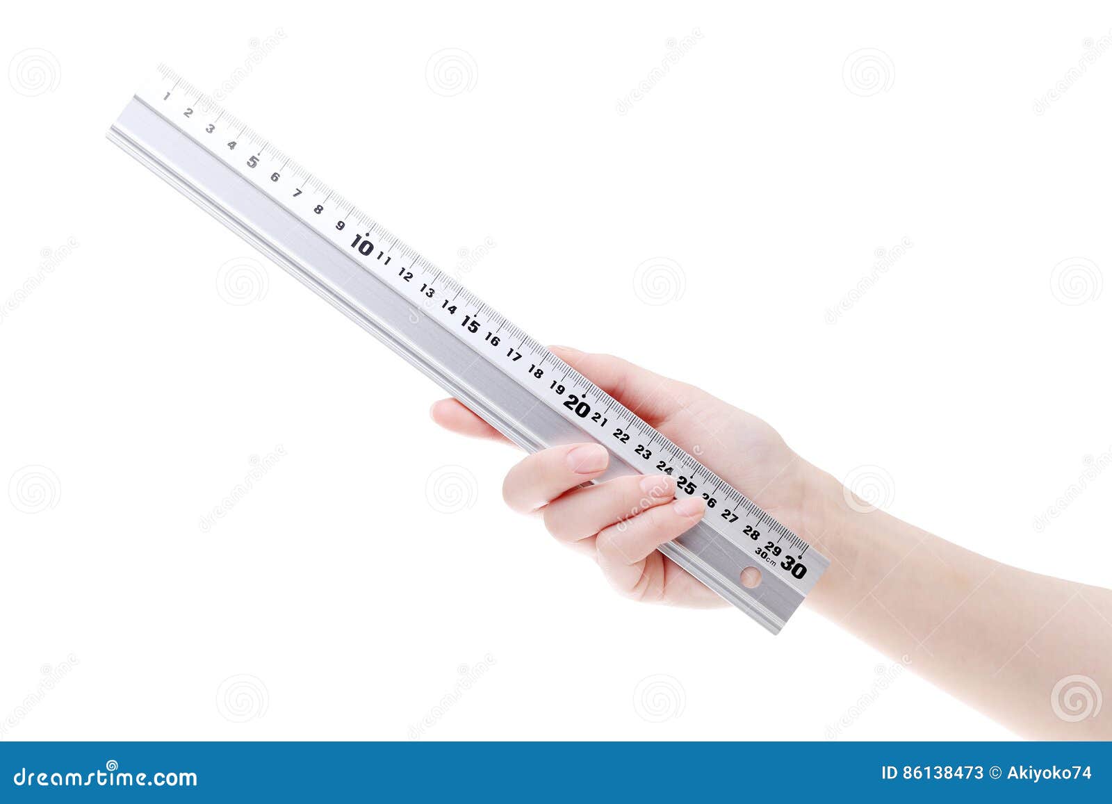 Hand holding metal ruler stock image. Image of isolated - 86138473