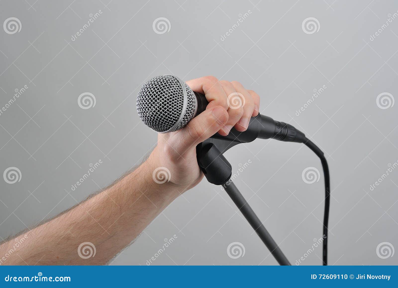 Hand holding microphone stock photo. Image of record - 72609110