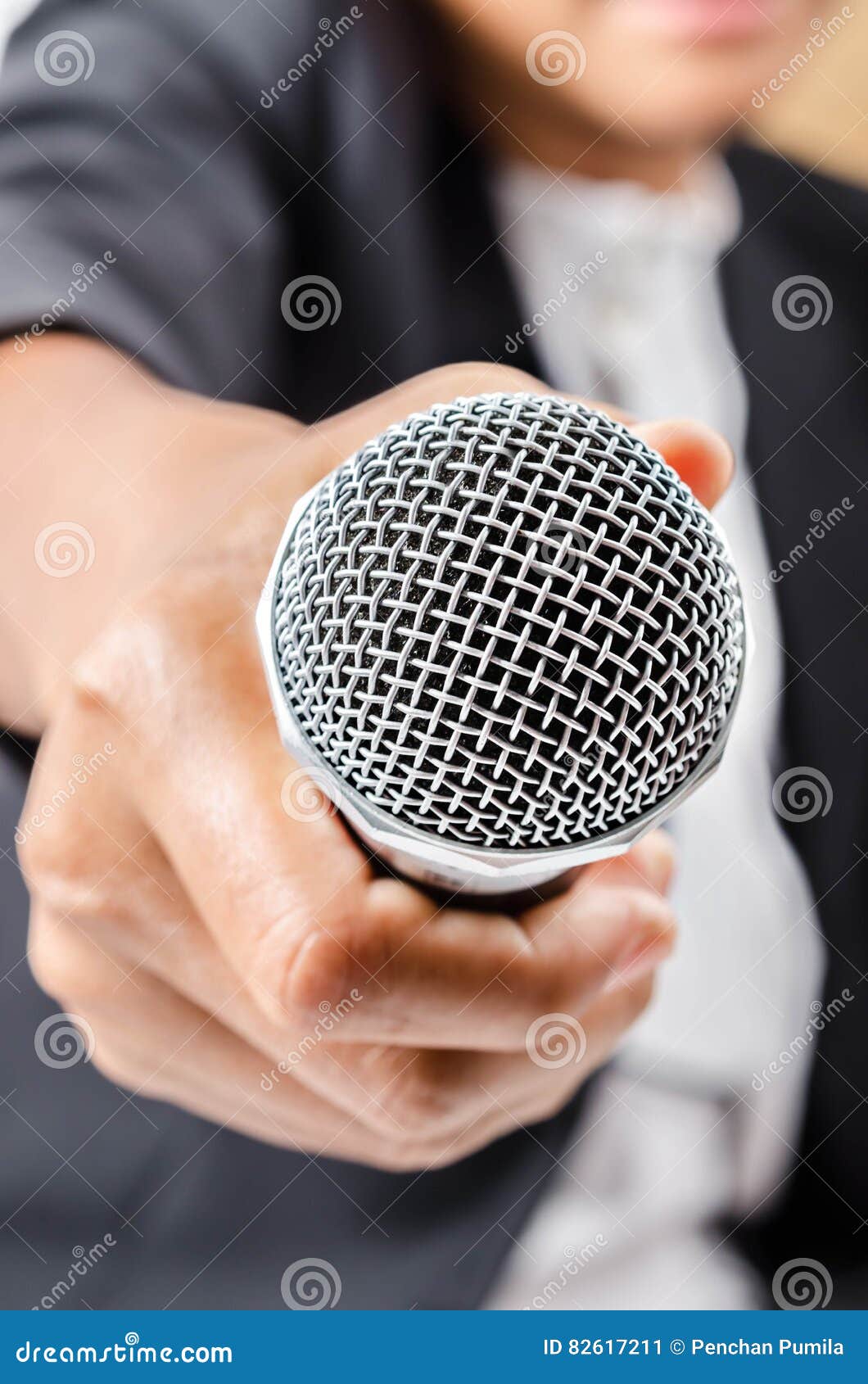 Hand holding a microphone. stock image. Image of interview - 82617211
