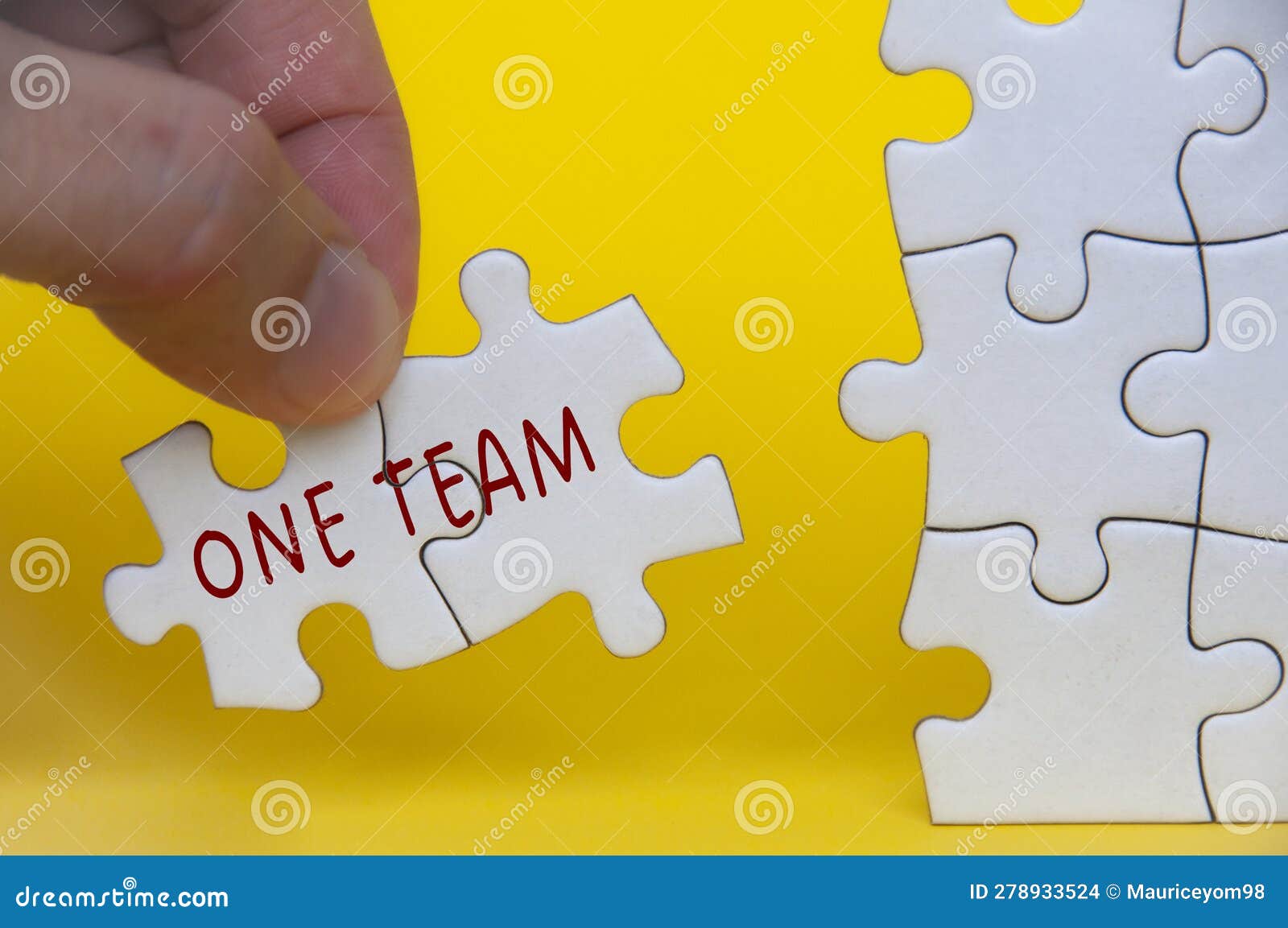 Hand Holding Missing Jigsaw Puzzle with One Team Text. Teamwork Concept ...