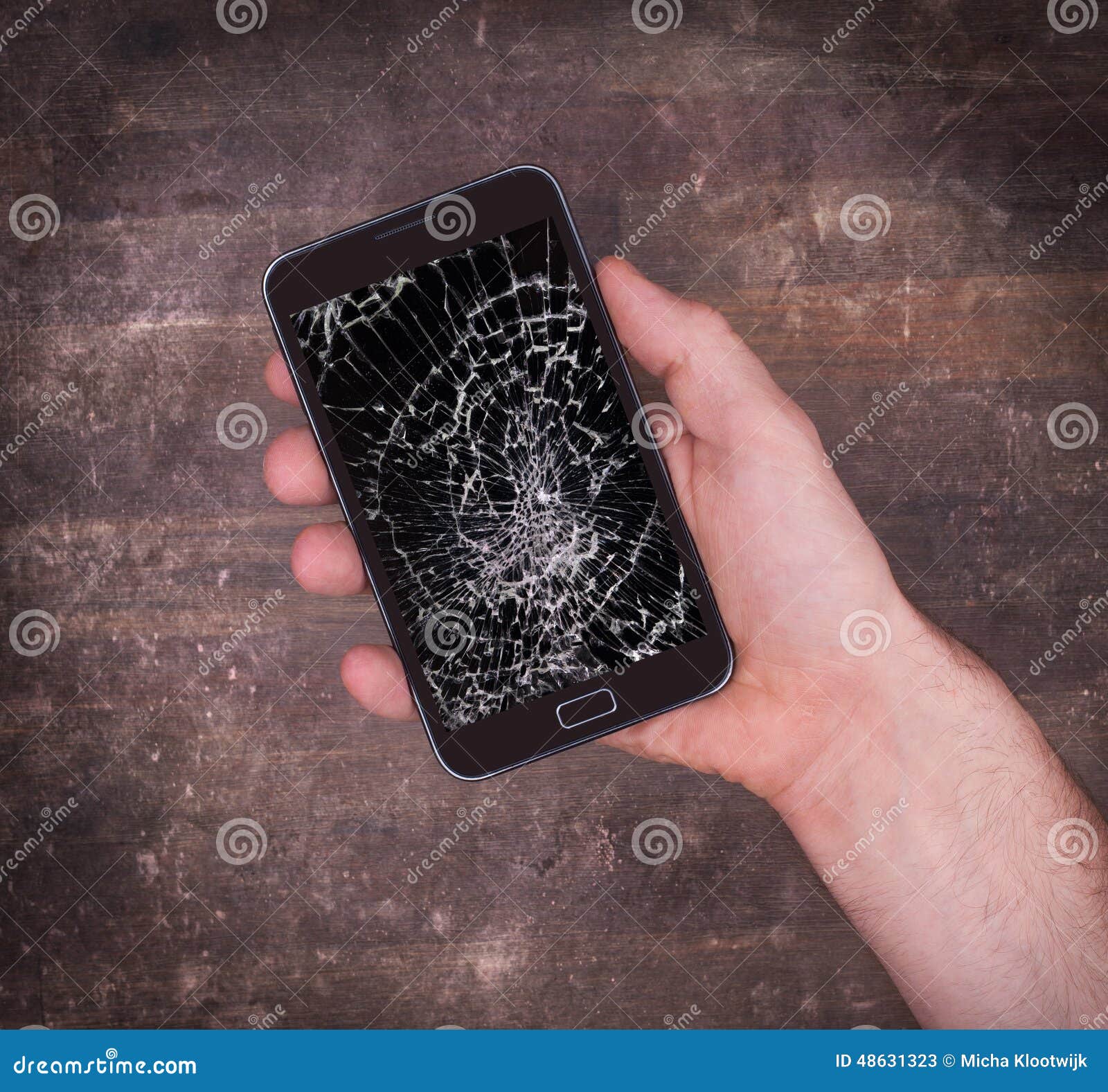 Hand Holding a Mobile Phone with a Broken Screen Stock Image - Image of ...
