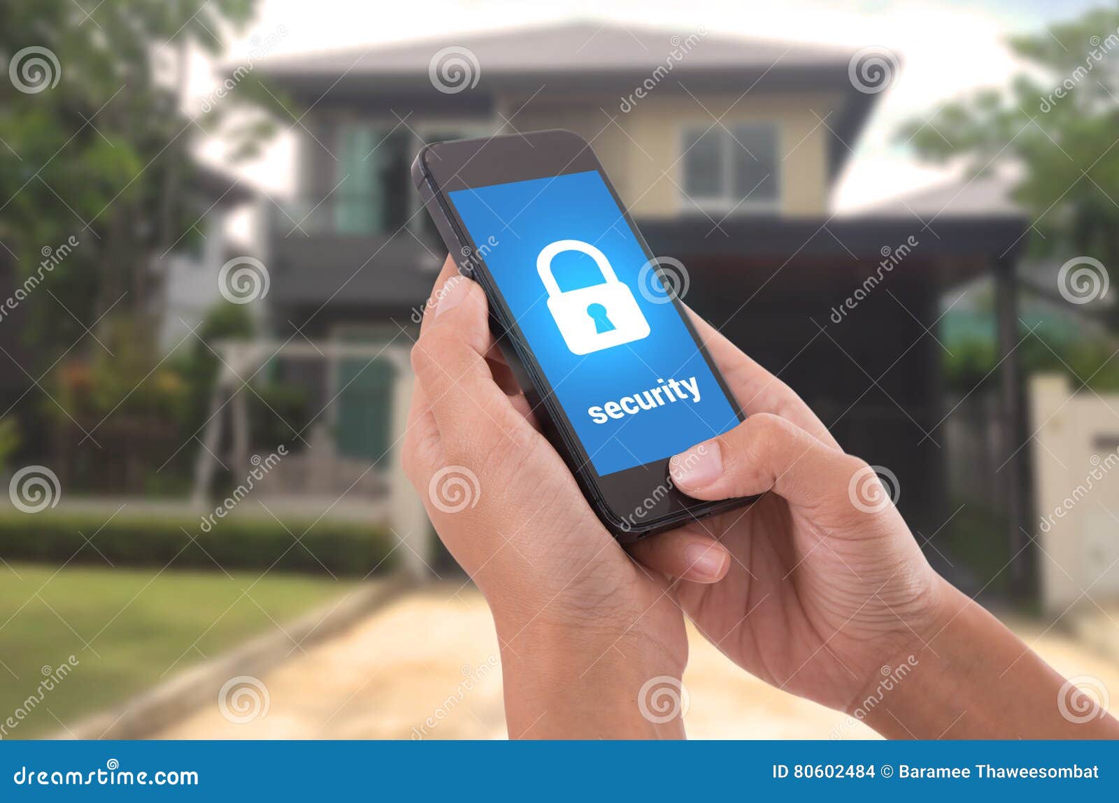 Hand Holding Mobile Phone with Concept Technology Home Security Stock ...