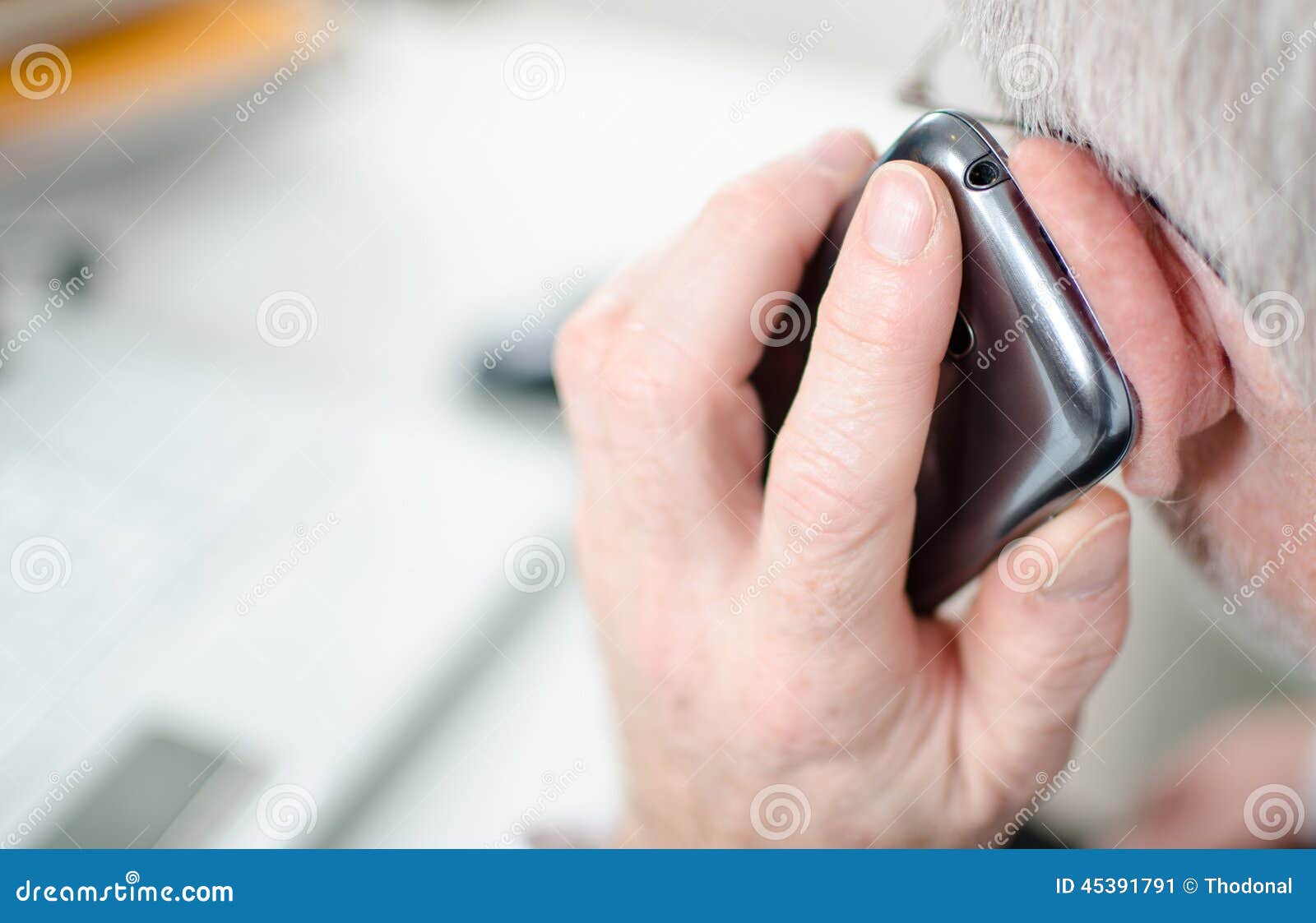 Hand Holding a Mobile Phone To His Ear Stock Image - Image of closeup ...