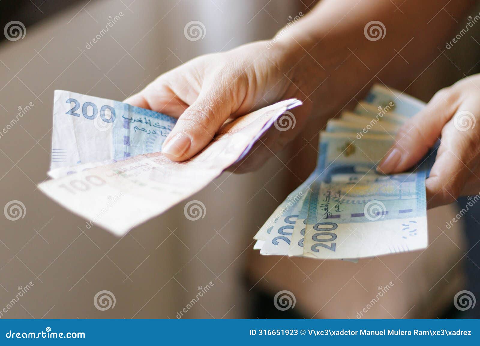 Hand Holding Moroccan Banknotes, Dirham Official Currency of Morocco ...