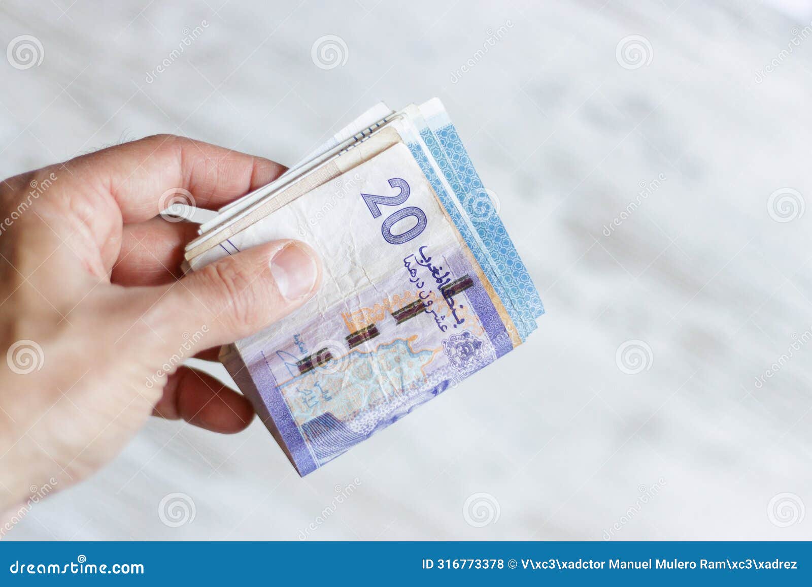 Hand Holding Moroccan Banknotes, Dirham Official Currency of Morocco ...