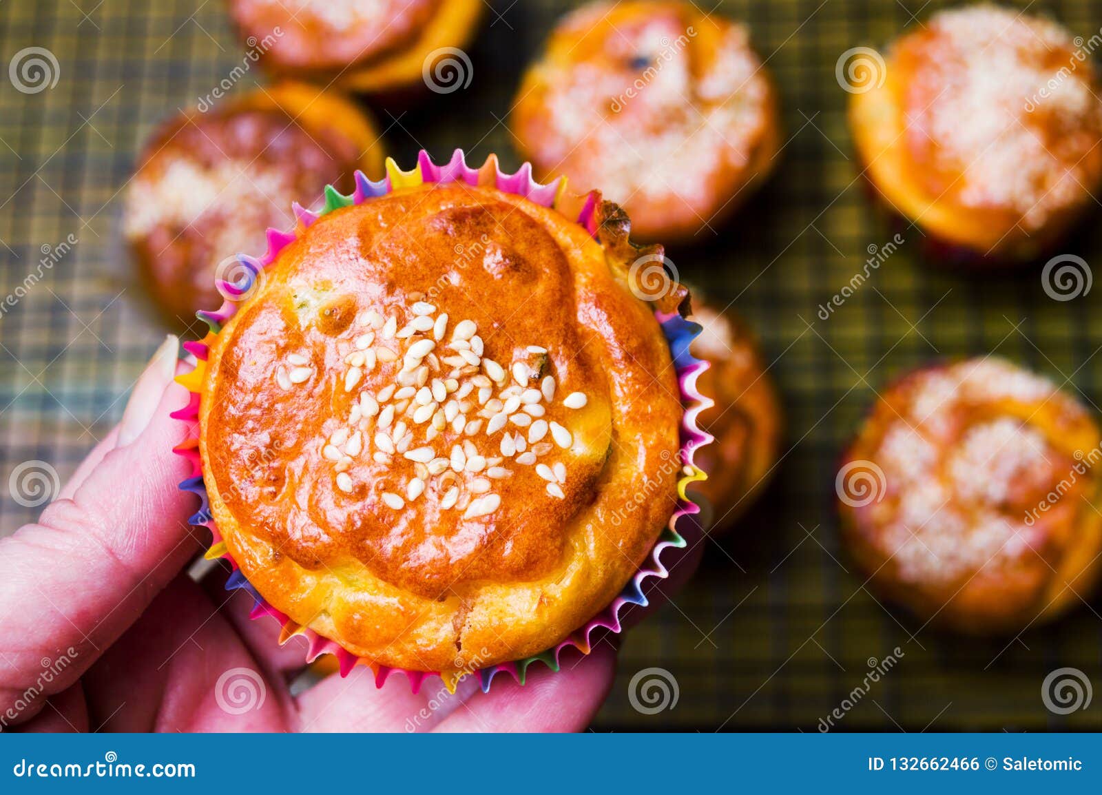 Hand Holding a Muffin with Seeds and Grains Stock Photo - Image of hand ...
