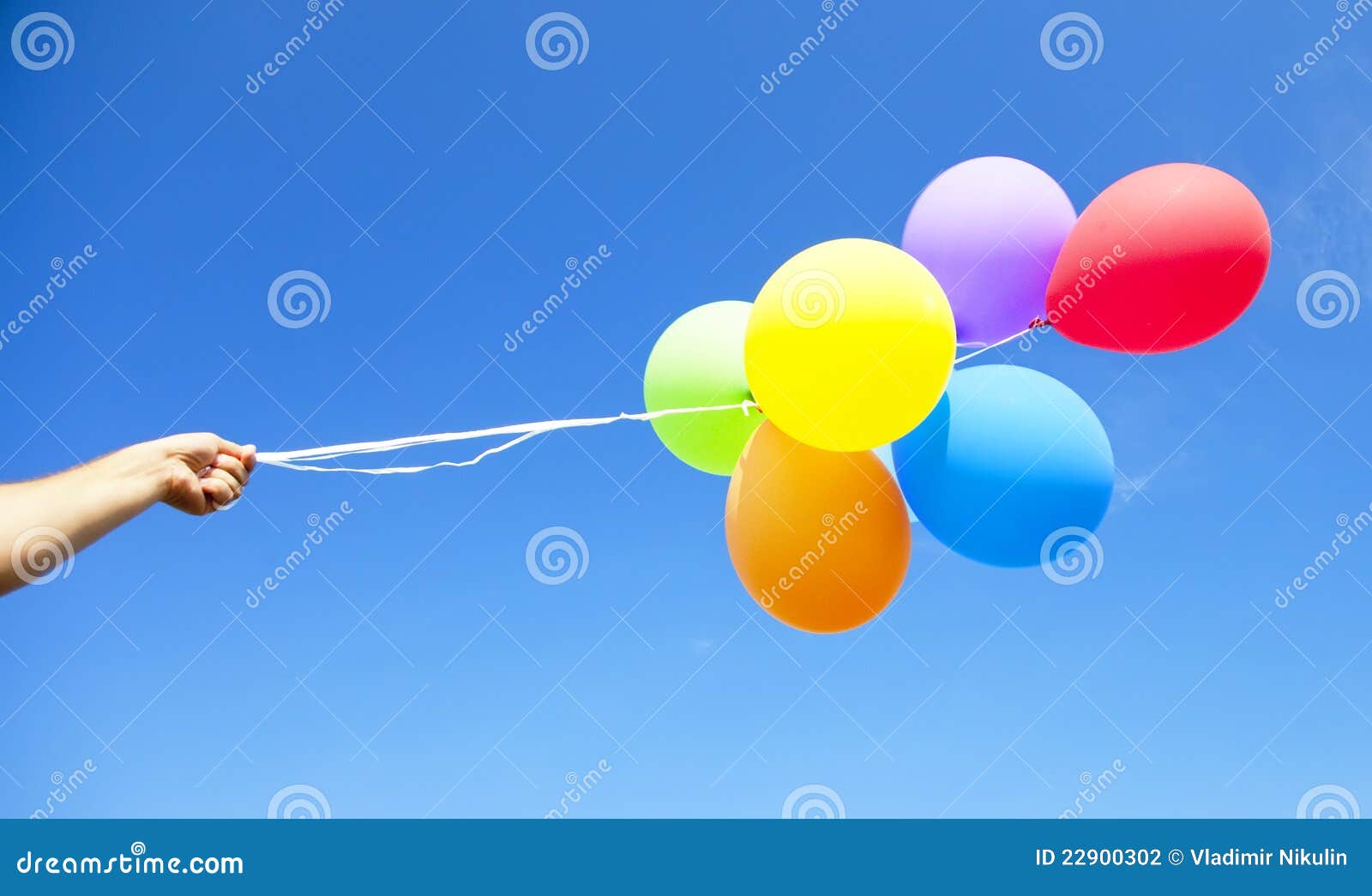 Hand Holding Multicolored Balloons Stock Photo - Image of opening ...