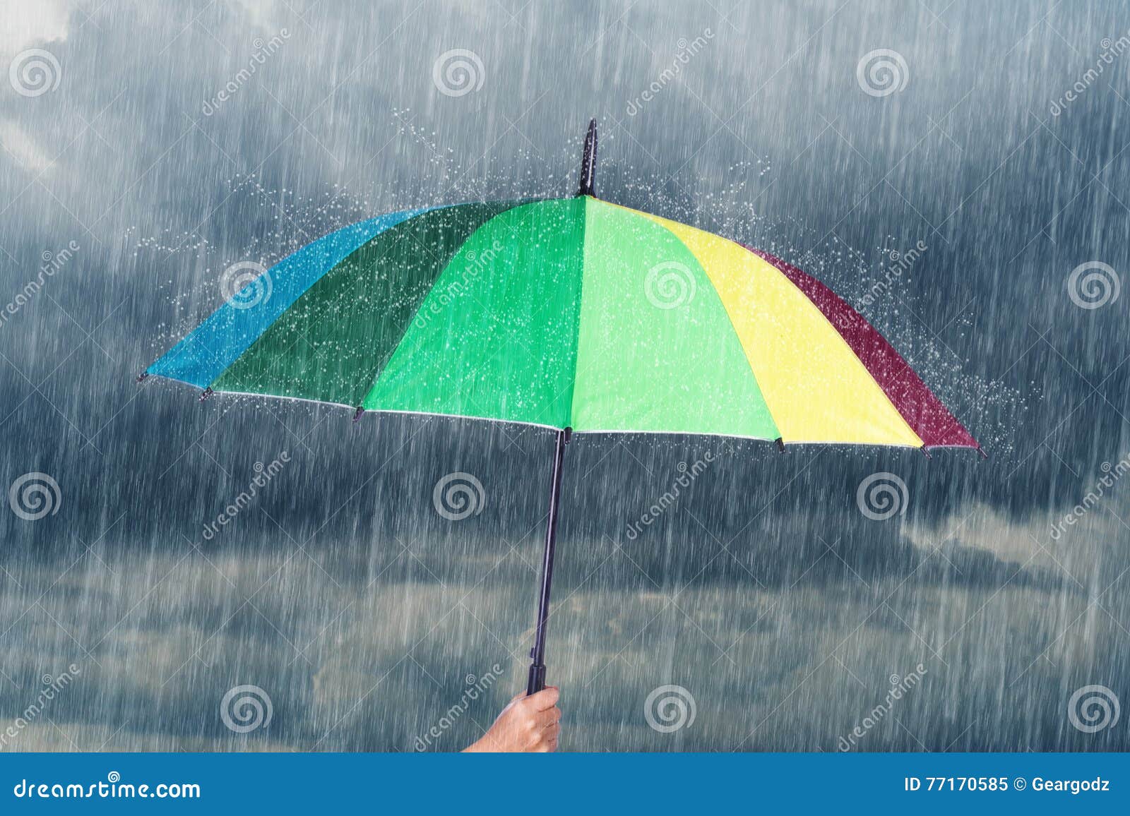 Hand Holding Multicolored Umbrella Under Dark Sky with Rain Stock Image ...