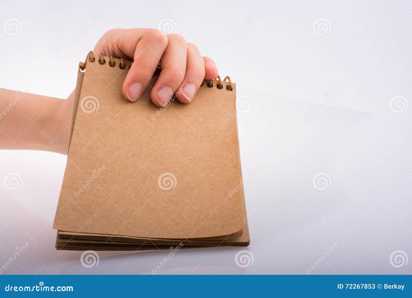 Hand holding a notebook stock image. Image of book, classroom - 72267853
