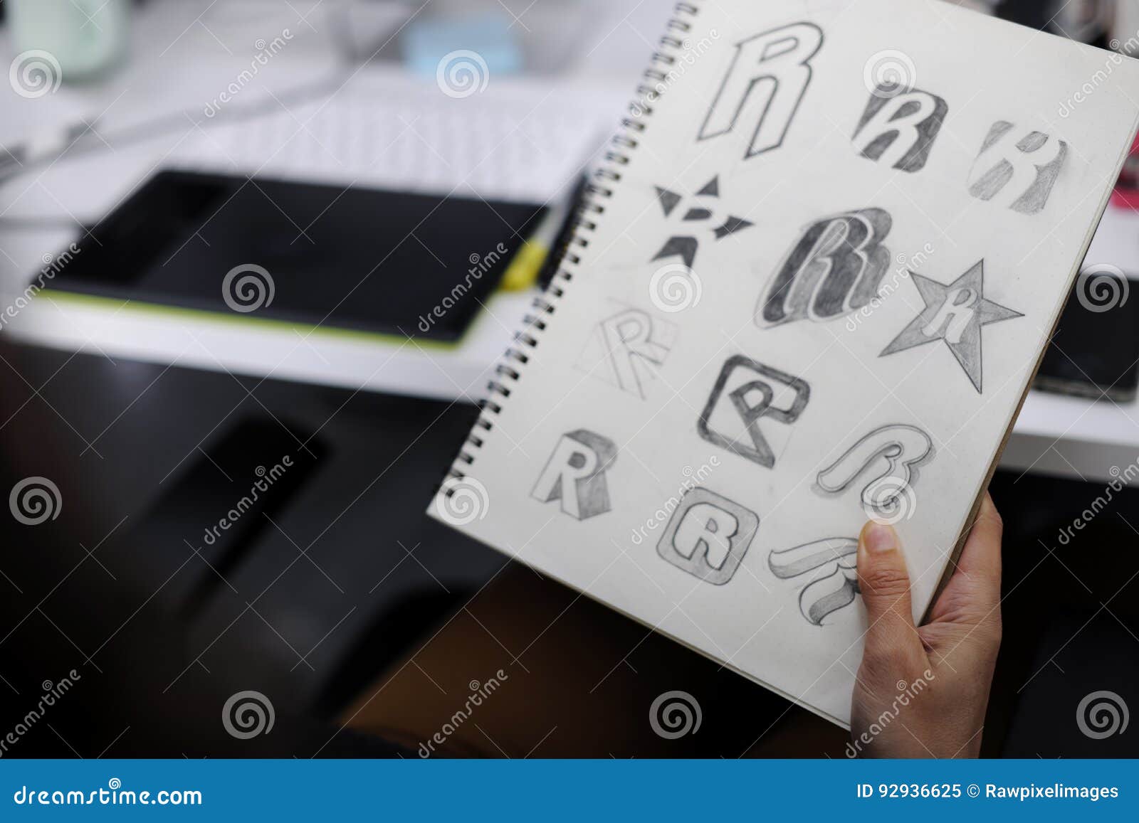 Hand Holding Notebook with Drew Brand Logo Creative Design Ideas Stock ...