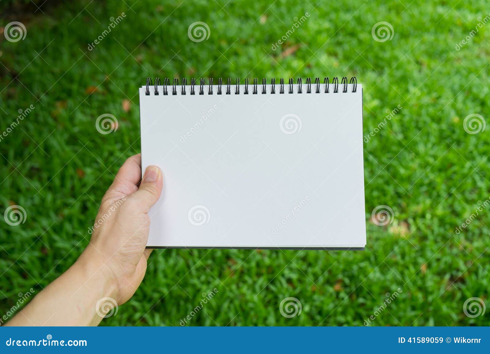 Hand holding notebook stock image. Image of notebook - 41589059