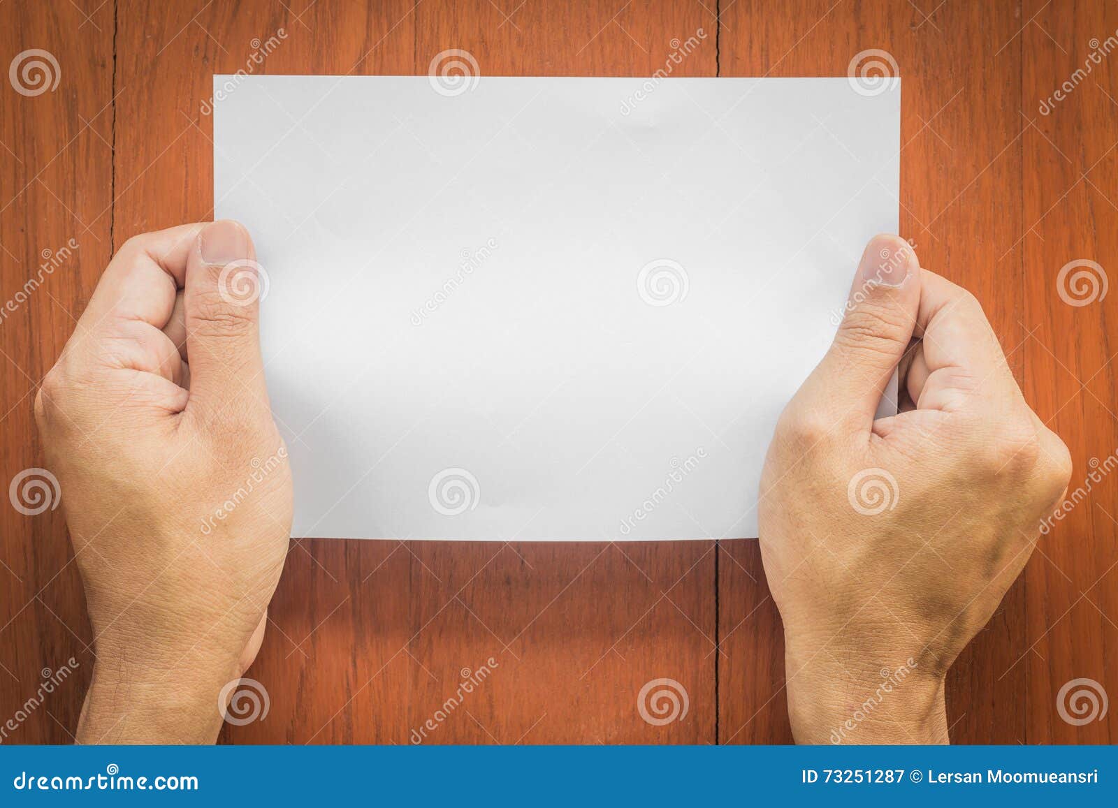 The Hand Holding a Notes Paper on Wood Background. Stock Image - Image ...