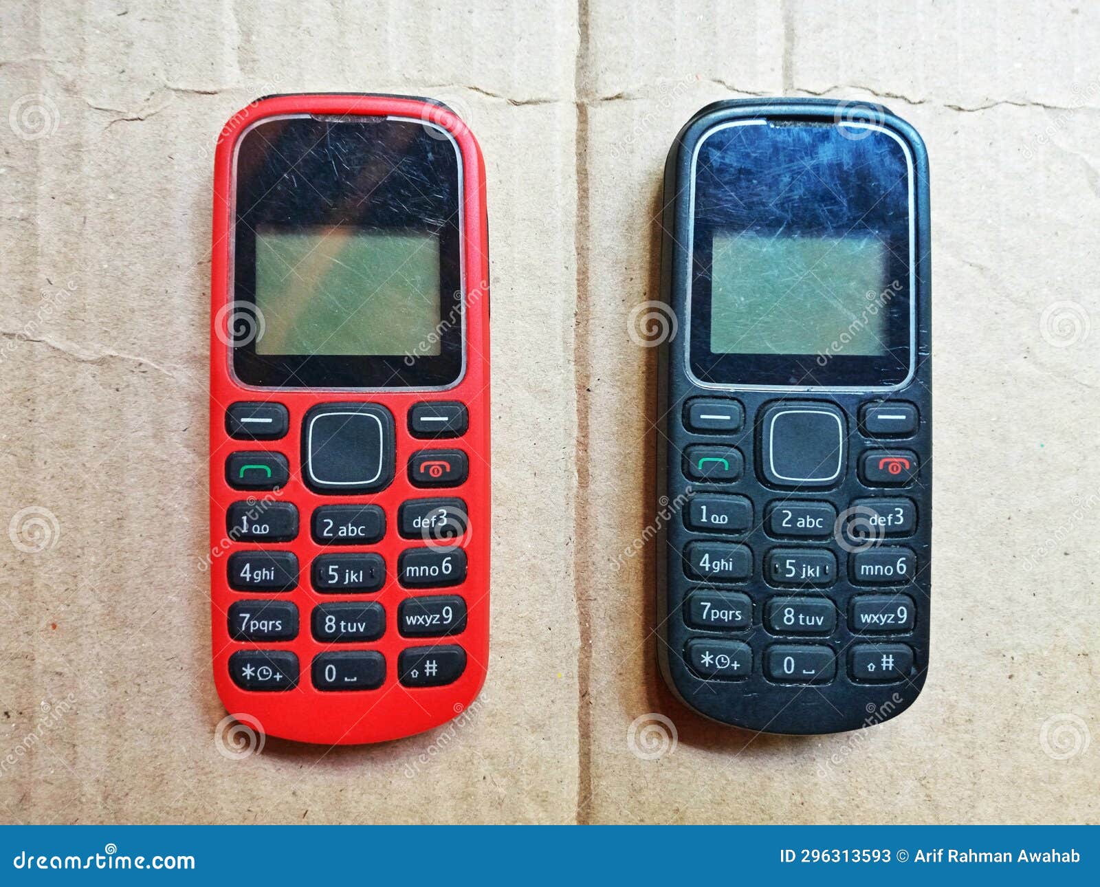 Hand Holding Old Mobile Phone with Texting or SMS Button Keyboard or ...