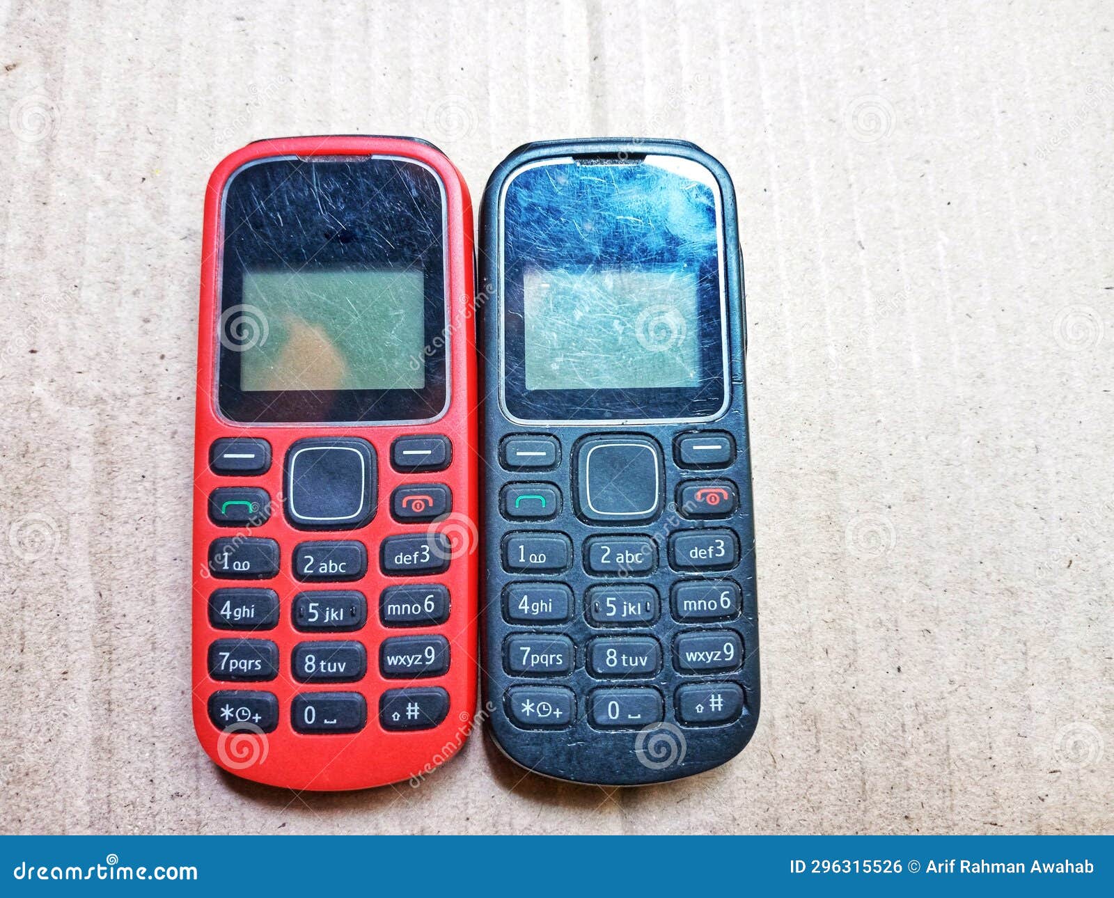 Hand Holding Old Mobile Phone with Texting or SMS Button Keyboard or ...