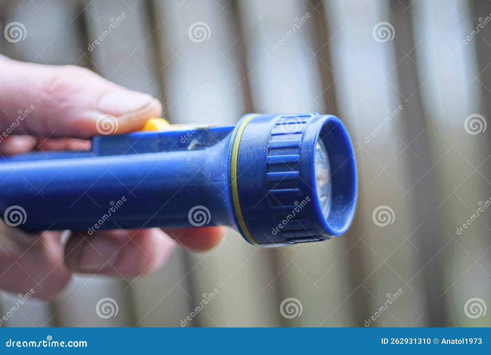 Hand Holding One Blue Plastic Flashlight Stock Photo - Image of ...