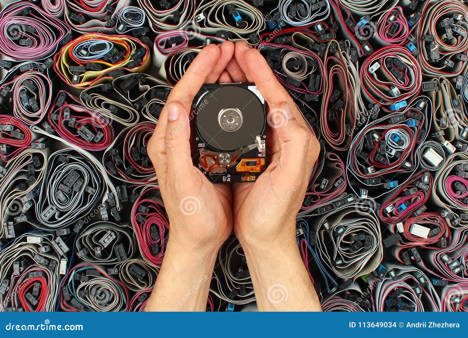 Hand Holding Open Hard Disk Drive, Against Computer Cables Stock Photo ...