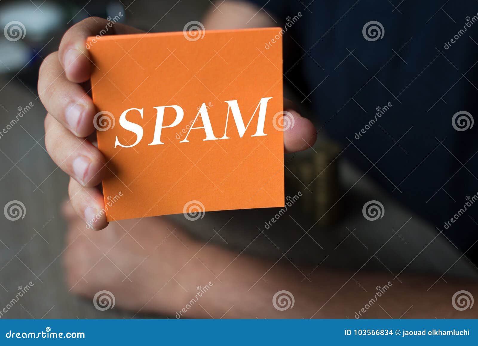Hand Holding Orange Paper with the Word Spam, Technology Concept Stock ...