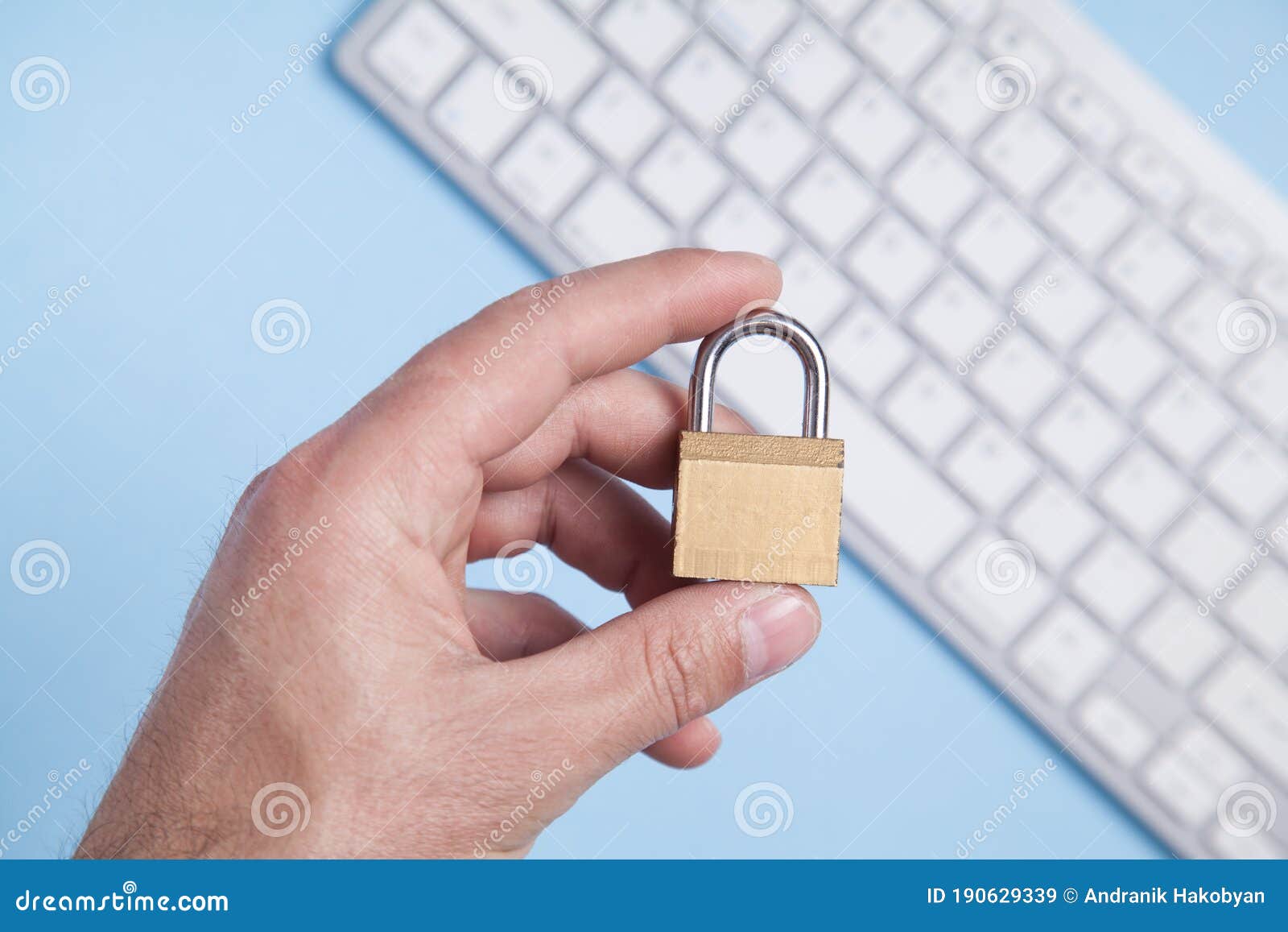 Hand Holding Padlock Over Computer Keyboard. Internet and Computer ...