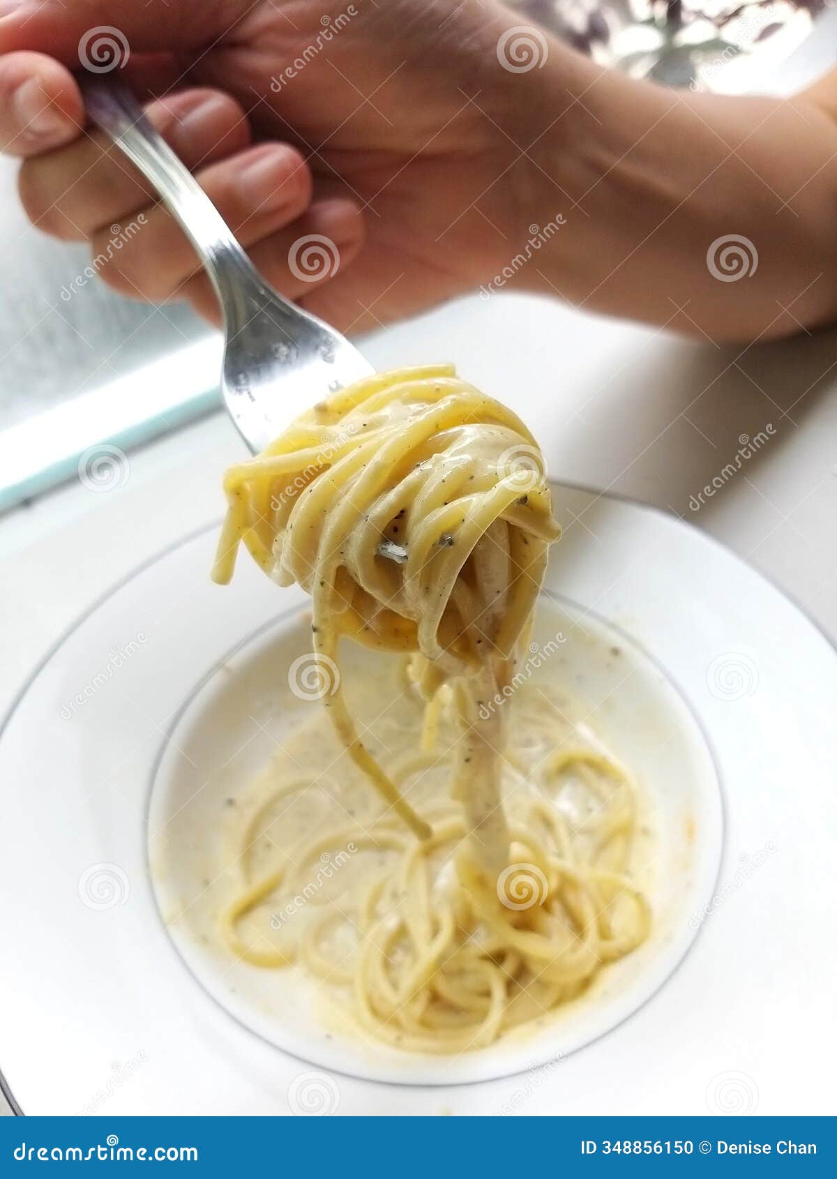 Hand Holding Spaghetti on Fork Stock Photo - Image of farinaceous ...