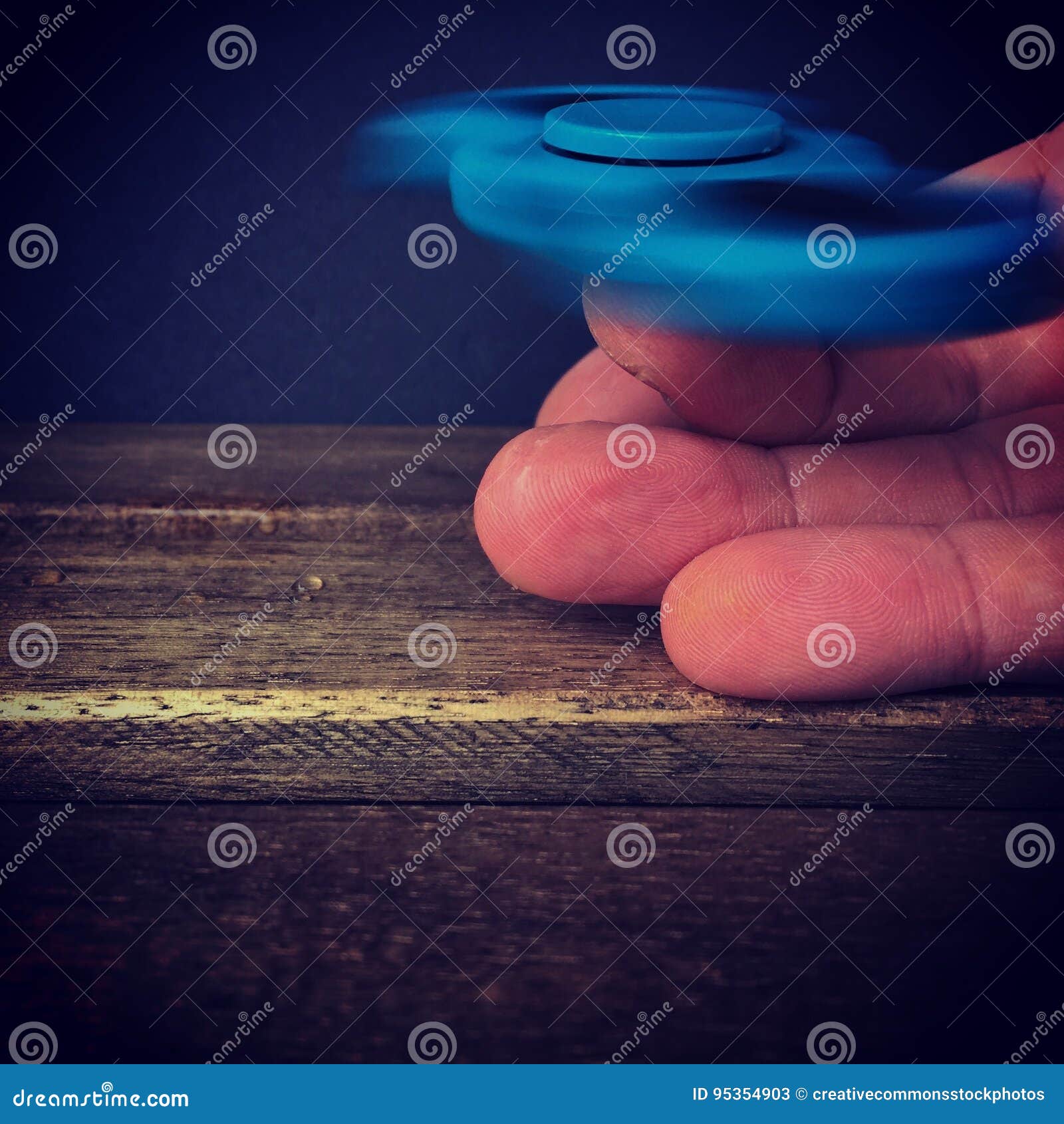 Hand Holding Peg Top Picture. Image: 95354903