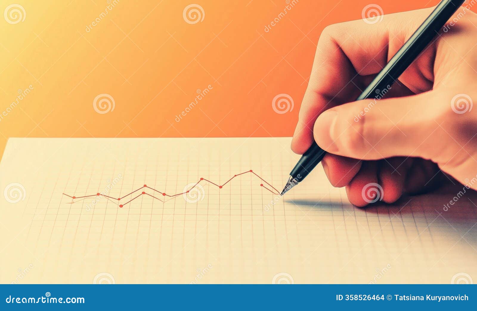 Hand Holding Pen Drawing Line Graph on Grid Paper, Illustrating Data ...